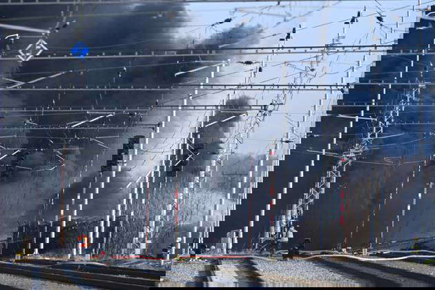 Firefighters are intervening at a large fire of a freight train ...