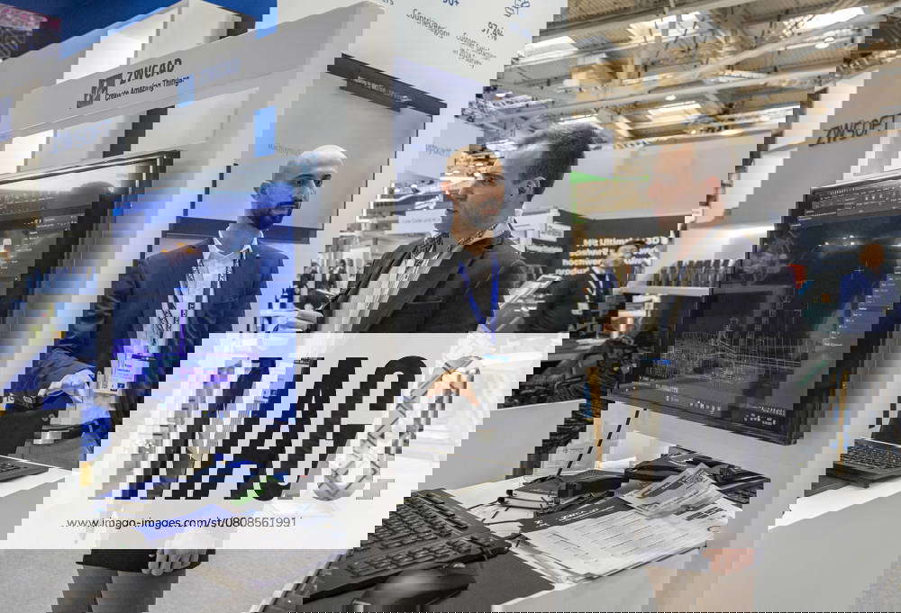 HANNOVER, Visitors talk at the exhibition booth of ZWSOFT at Hannover Messe 2025 in Hannover