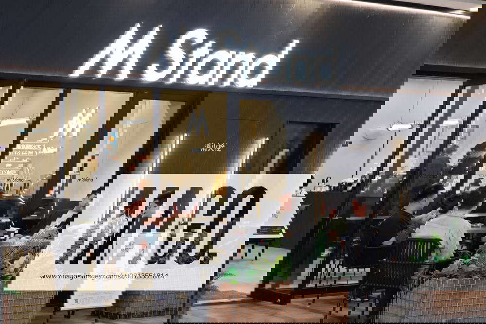 M Stand Coffee SHANGHAI, CHINA - Customers are having coffee and ...